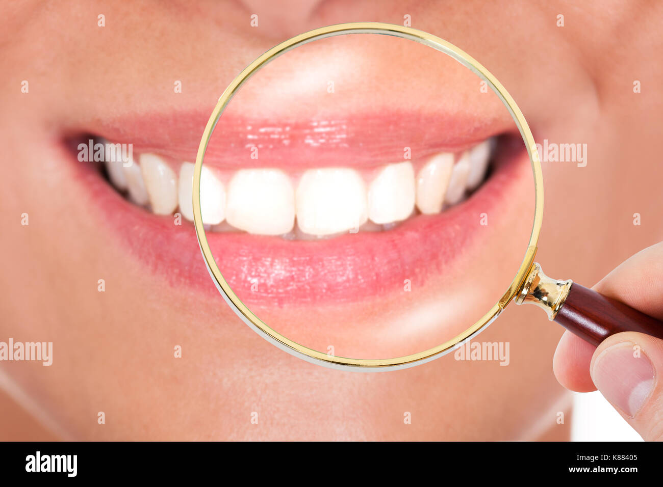 Teeth inspection magnifying glass hi-res stock photography and images ...