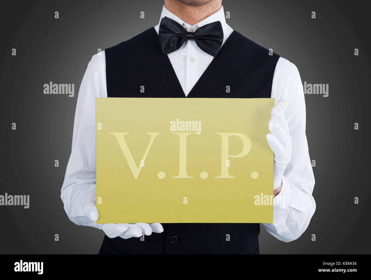 Close-up Of Waiter Showing Vip Text On Banner Stock Photo - Alamy