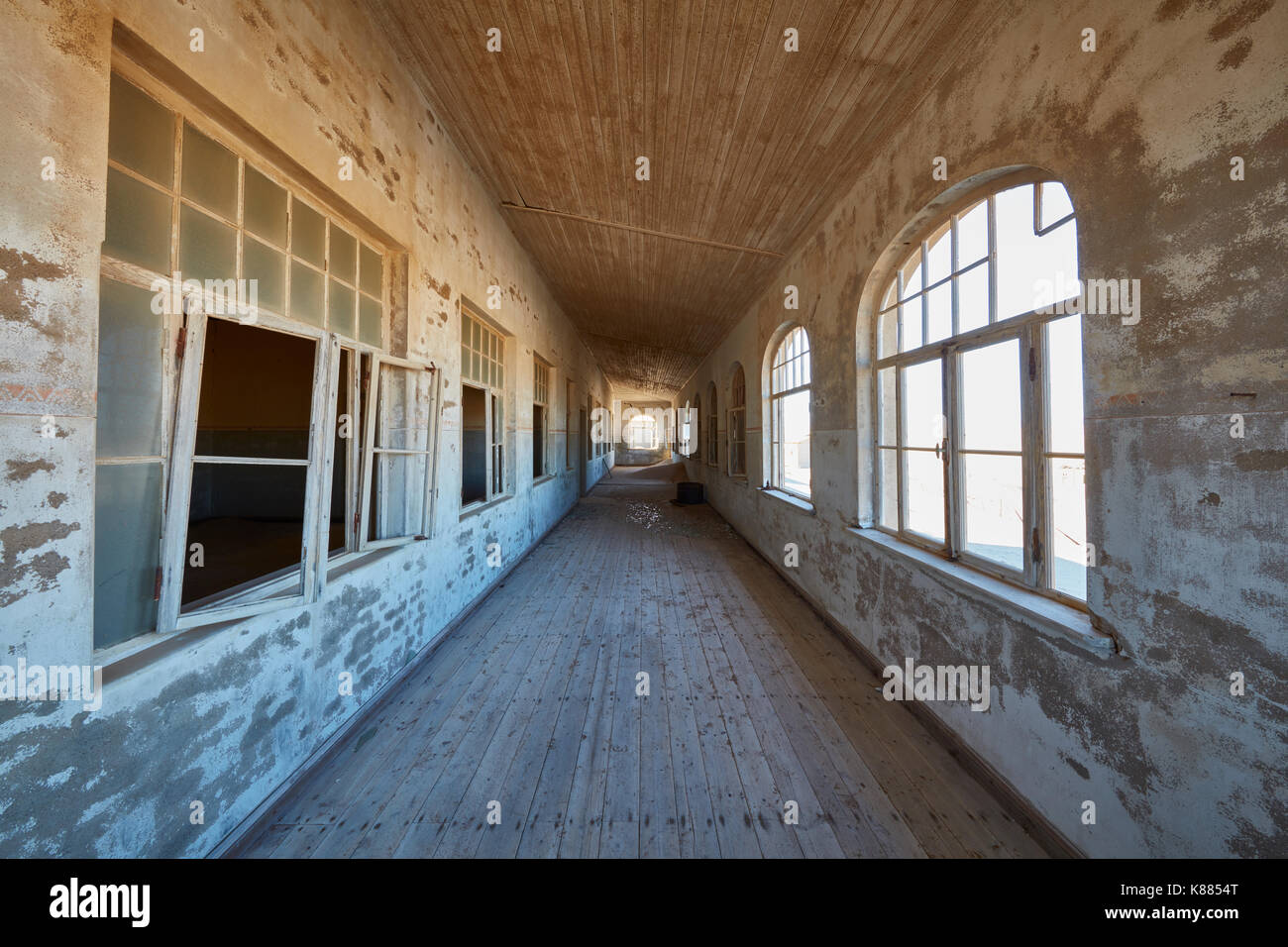A view of a corridor in a derelict building Stock Photo - Alamy