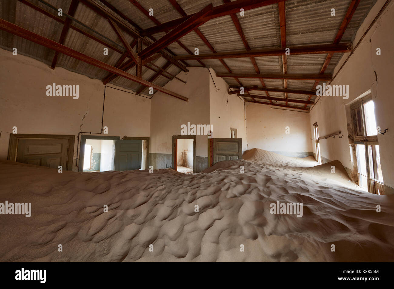 Interior of an abandoned building full of sand Stock Photo - Alamy