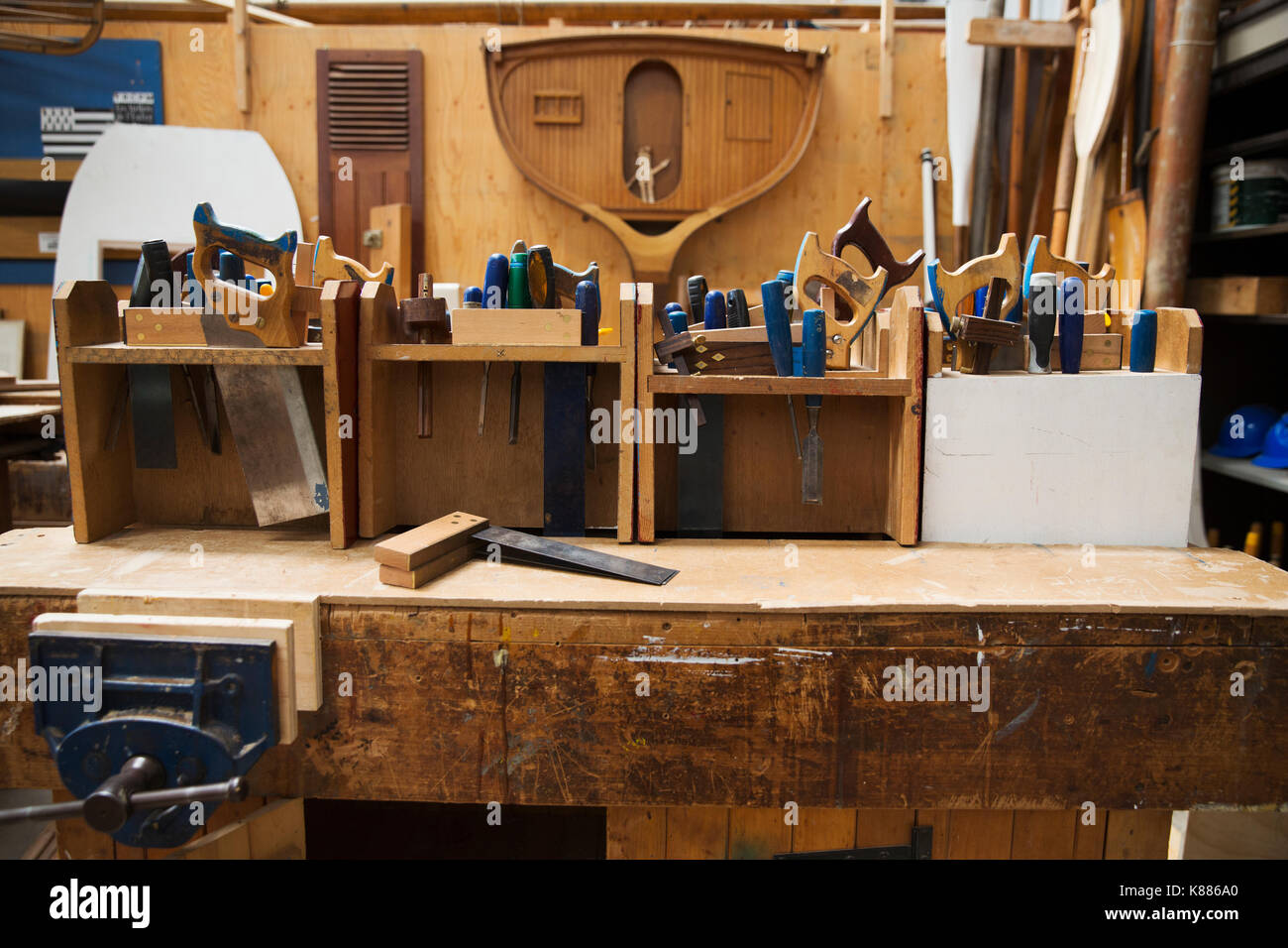 Work bench in a boat-builder's workshop, selection of hand tools for ...