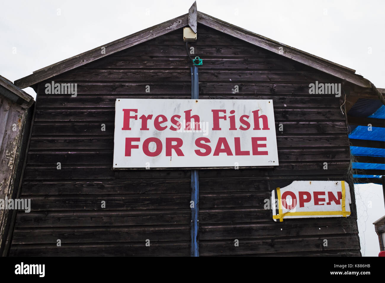 Exterior view of brown wooden fish shop on Suffolk coast Stock Photo ...