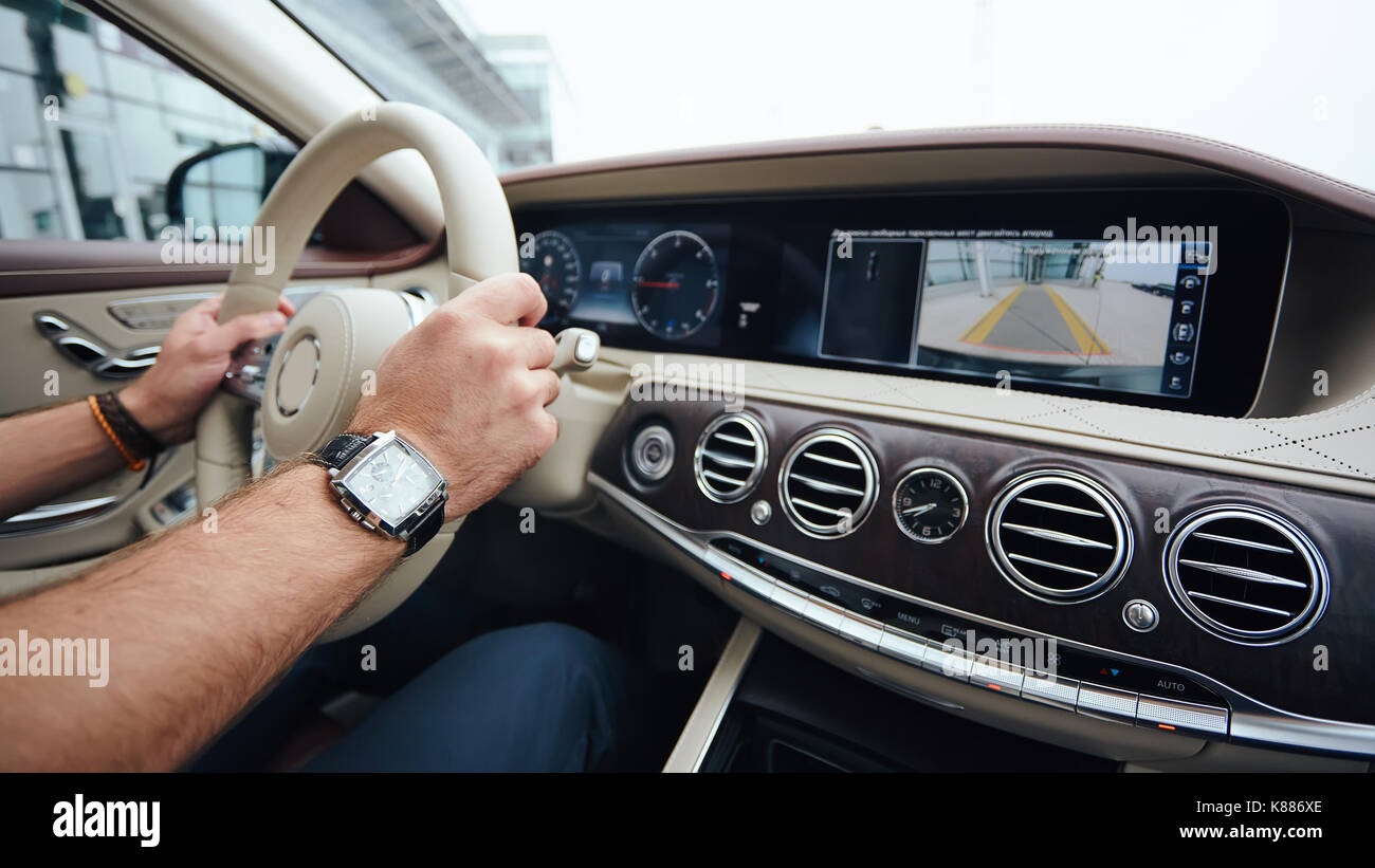 Man sitting and driving in the car Stock Photo - Alamy