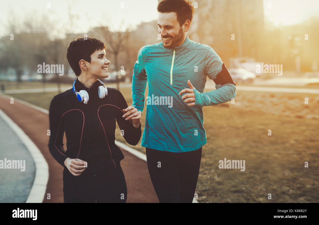 Two fit women running together hi-res stock photography and images - Alamy