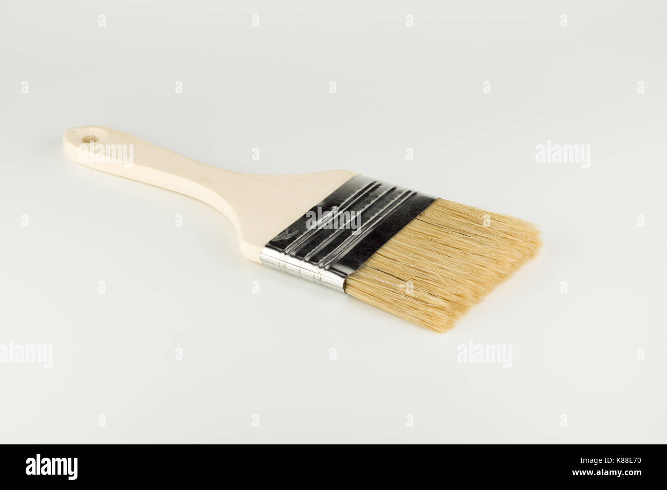 Large flat paint brush on white background Stock Photo - Alamy