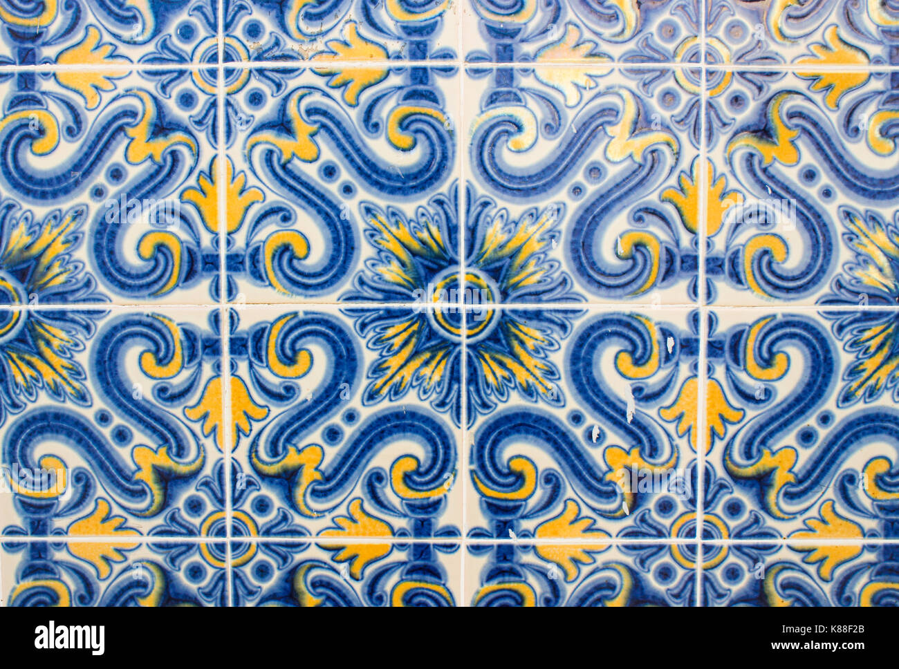 Ornate blue and yellow "azulejo" tiles decorating a building on the ...