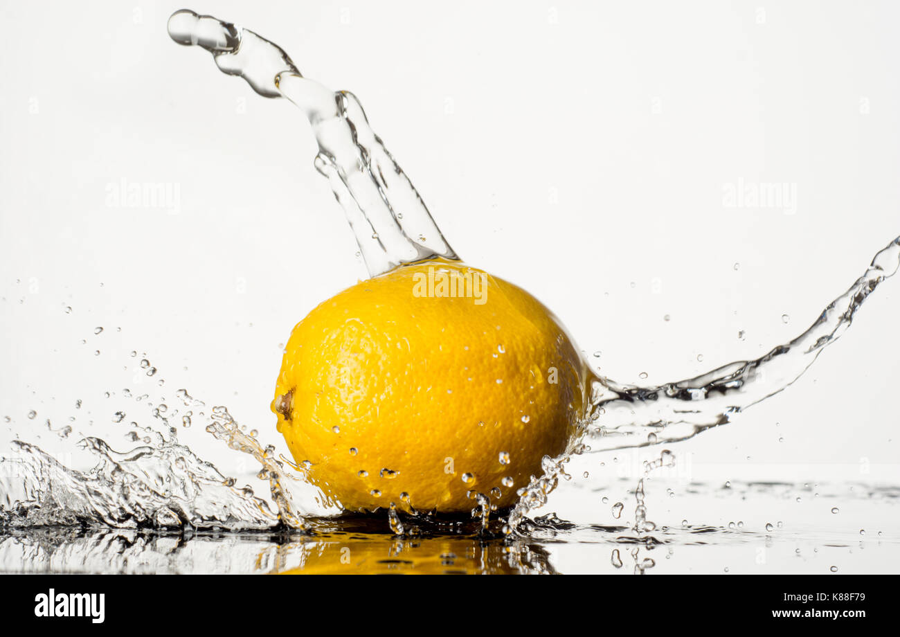 Lemon With Water Splash isolated on white background Stock Photo - Alamy