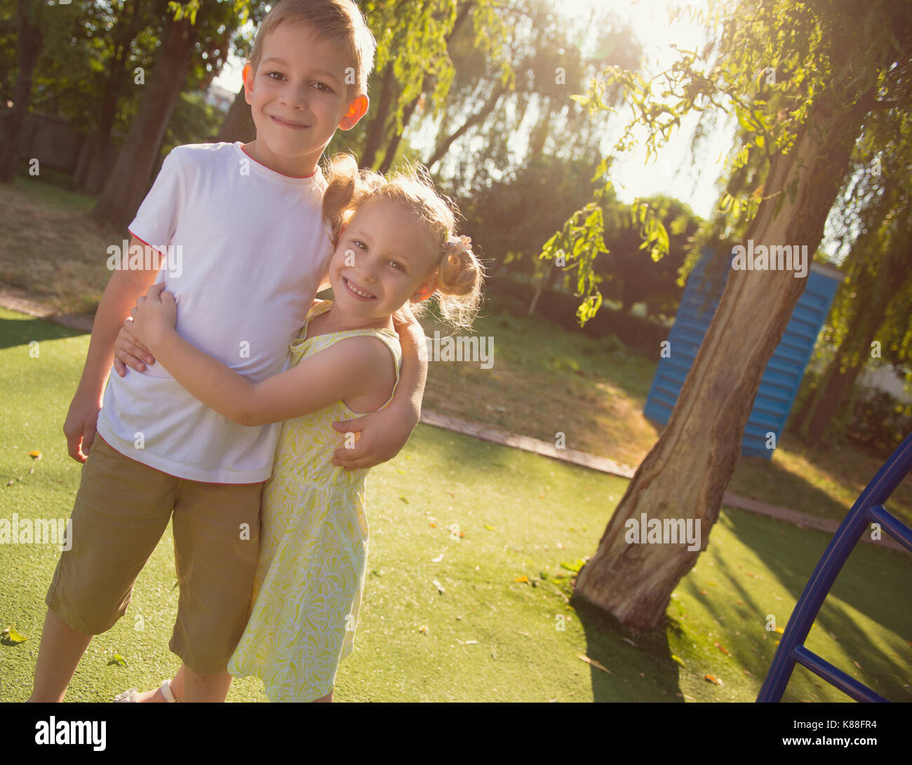 Happy cute kids having fun at playgraung Stock Photo - Alamy