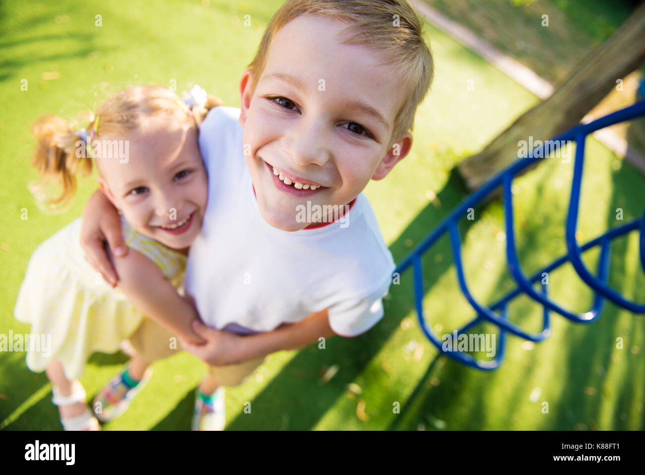 Happy cute kids having fun at playgraung Stock Photo - Alamy