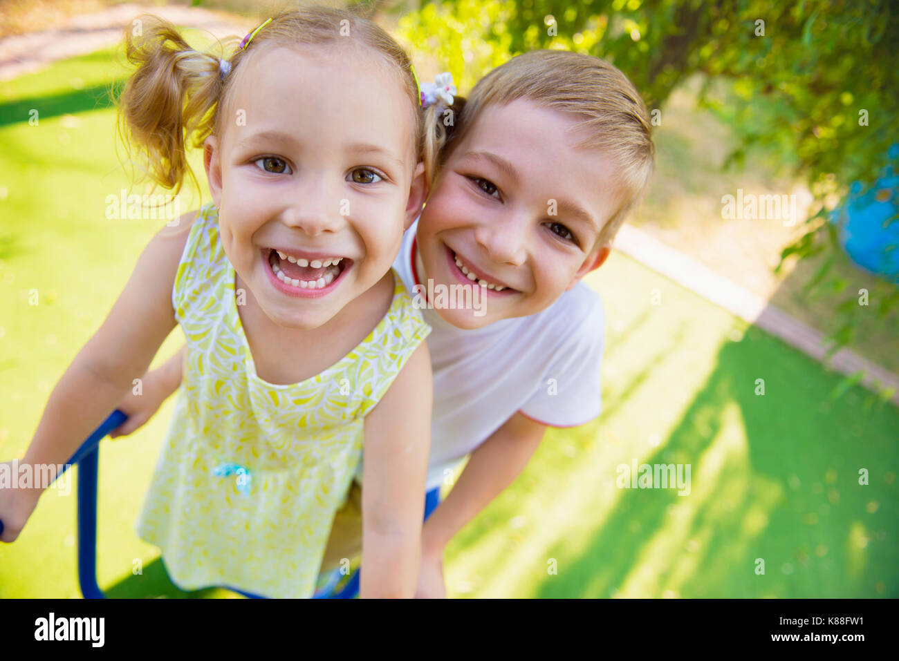 Happy cute kids having fun at playgraung Stock Photo - Alamy