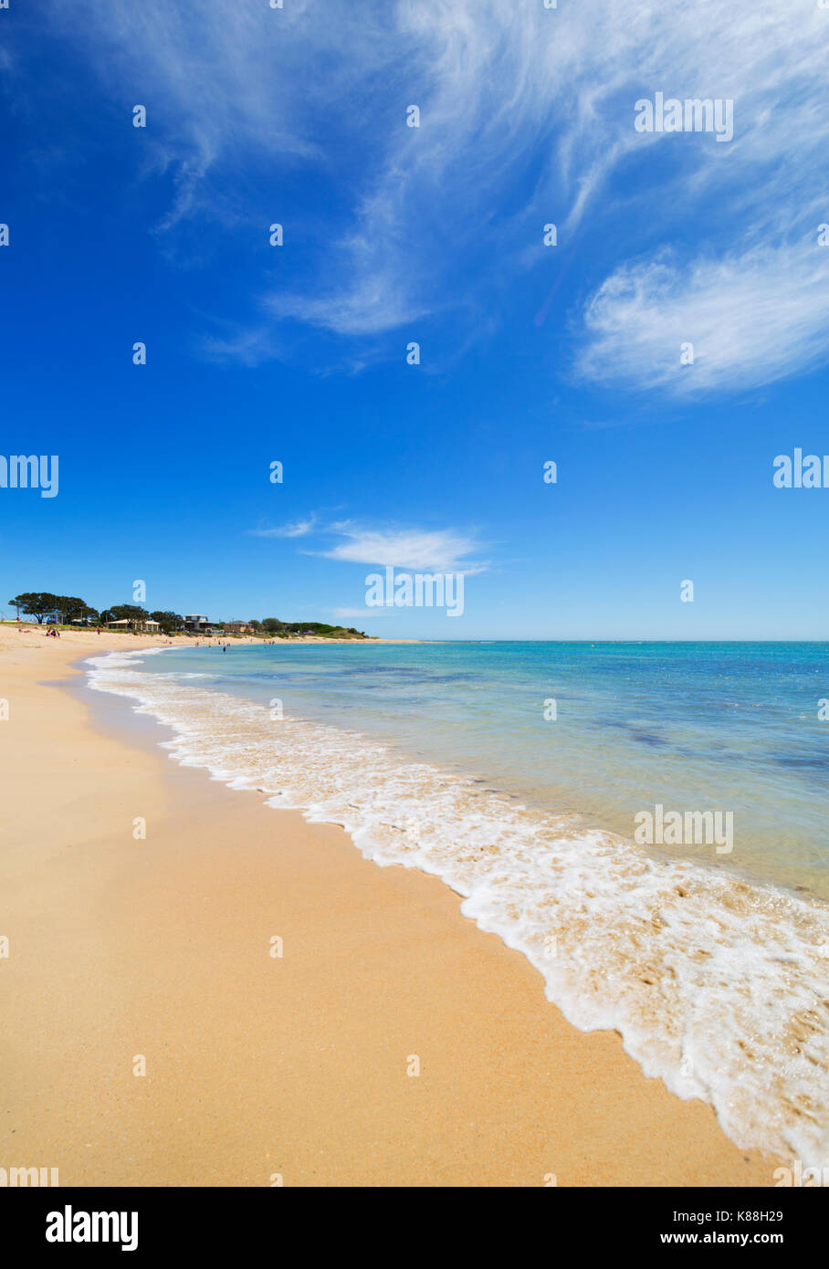 A wave breaking at Falcon Bay beach in Mandurah, Western Australia ...