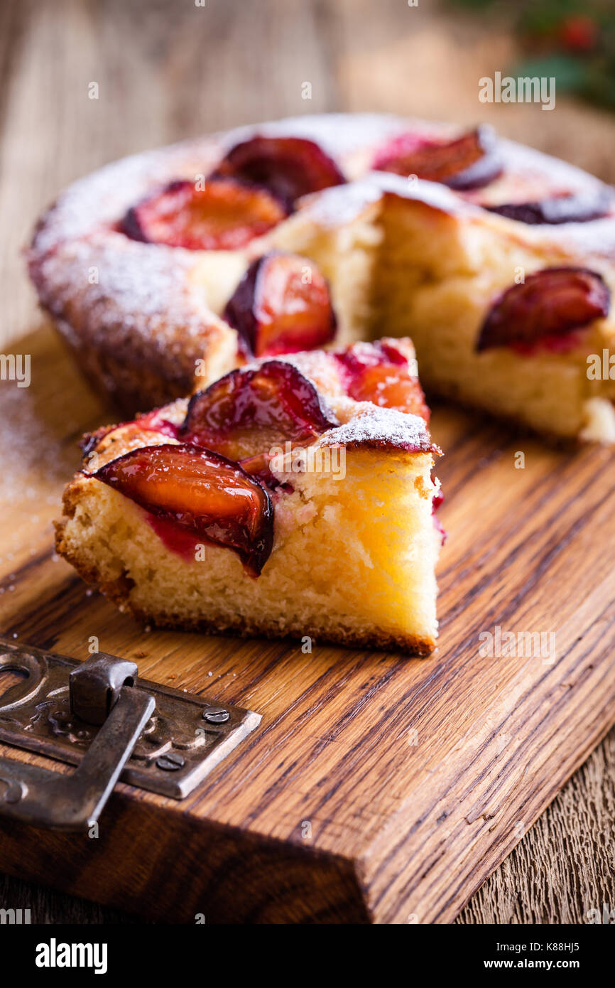 Summer fruit pie with fresh plums on rustic wooden table Stock Photo ...