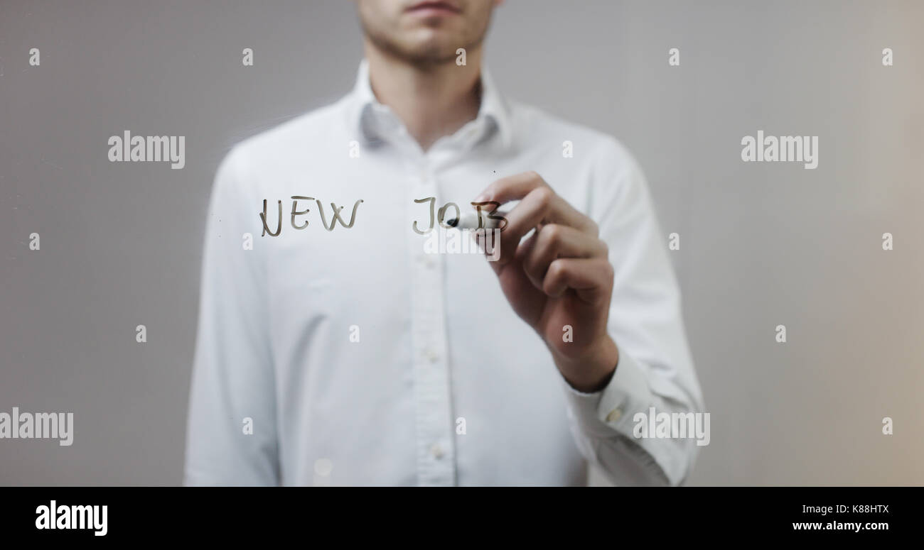 New job , Man Writing on Glass Stock Photo - Alamy