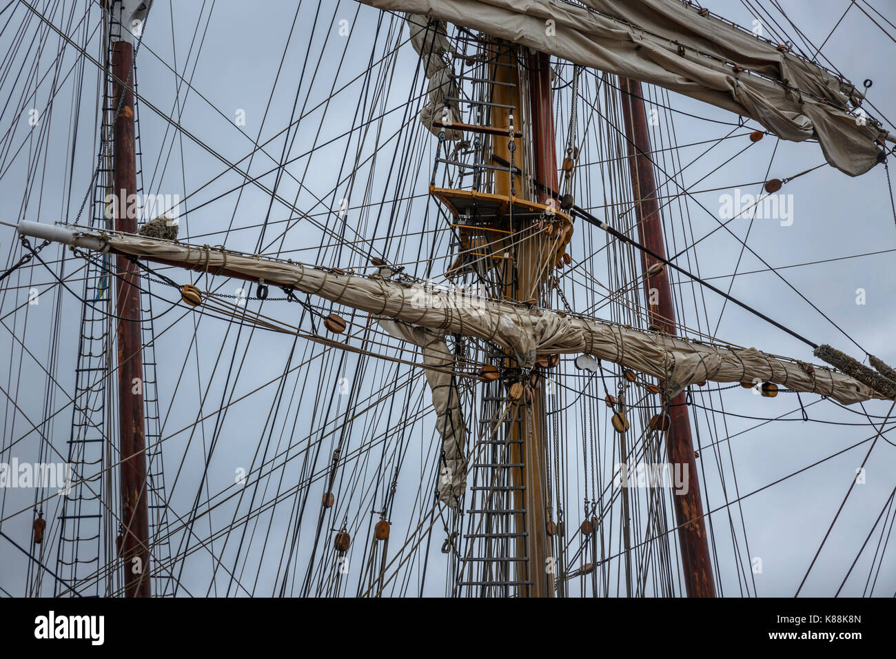 Closeup ropes and mast of a large sailing ship, anchored in ...
