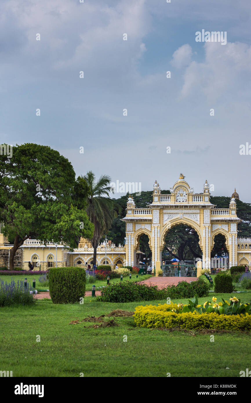 Mysore, India - October 27, 2013: Green garden with flowers in front of ...