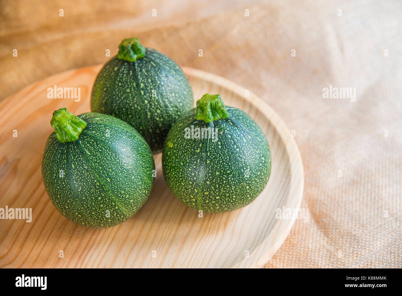 Three rounded courgettes. Still life Stock Photo - Alamy