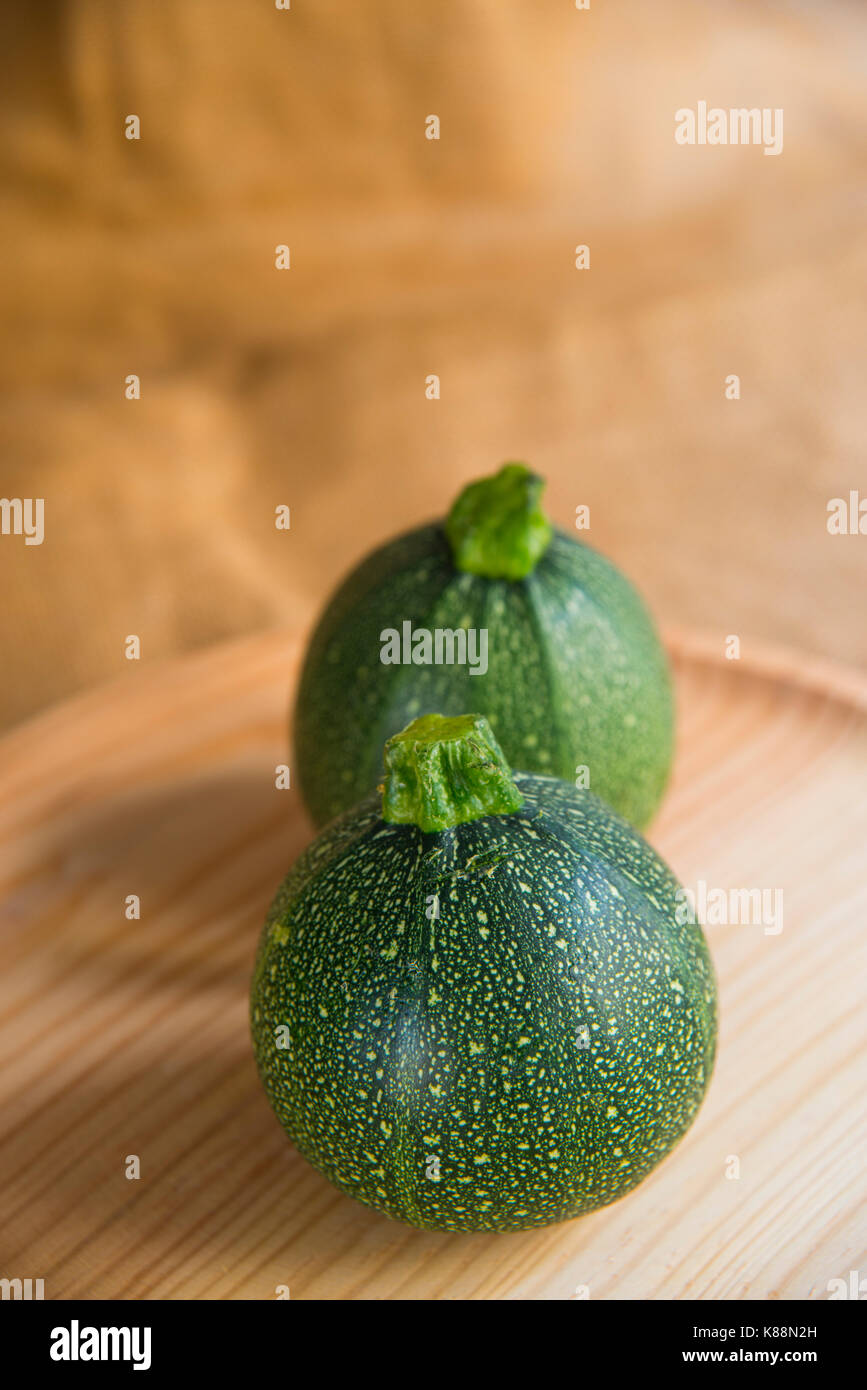 Two rounded courgettes. Still life Stock Photo - Alamy