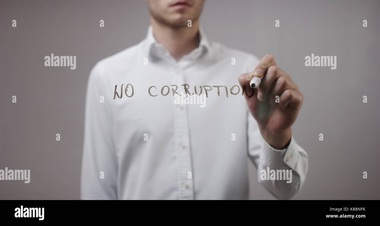 No corruption , Man Writing on Glass Stock Photo - Alamy