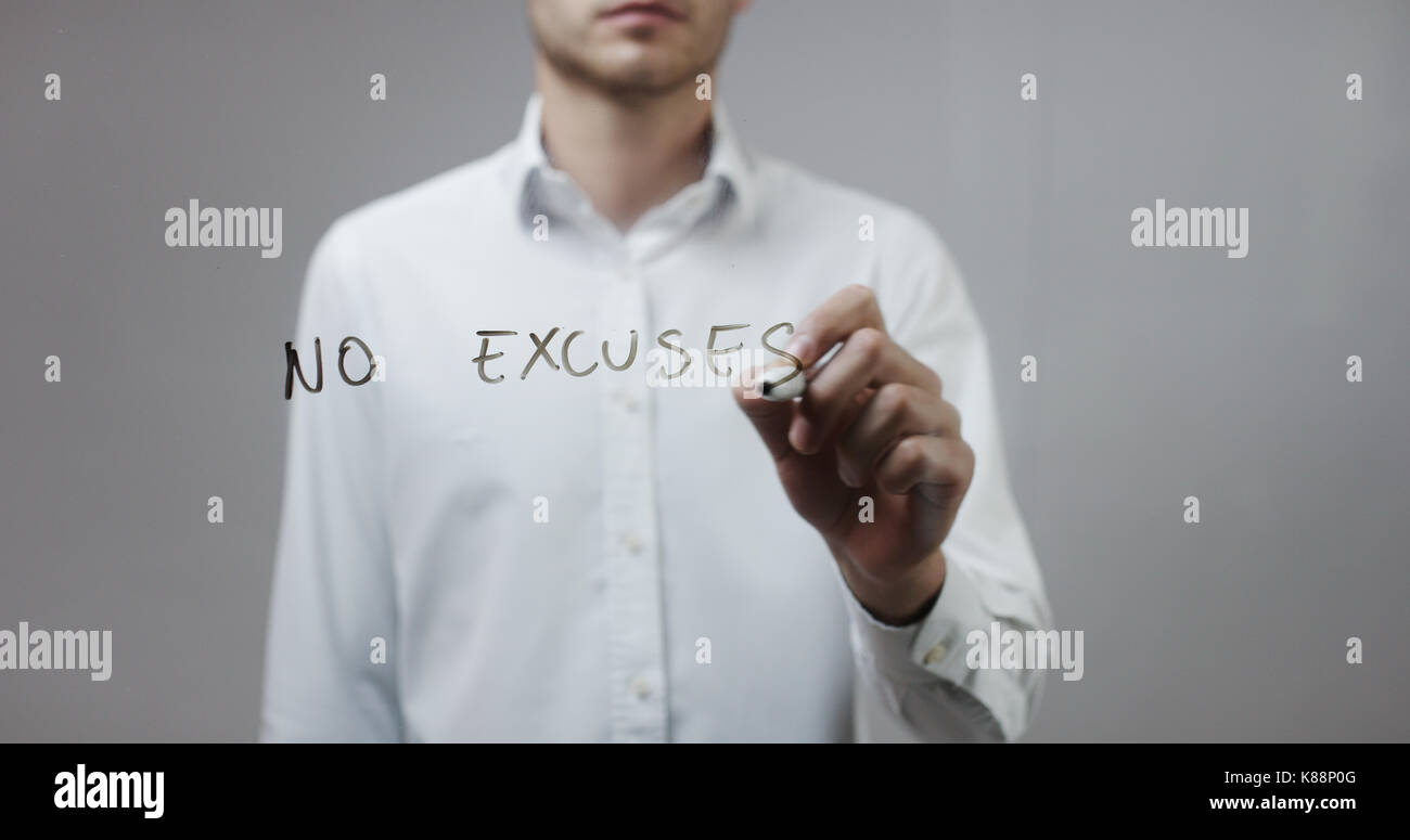 No excuses , Man Writing on Glass Stock Photo - Alamy