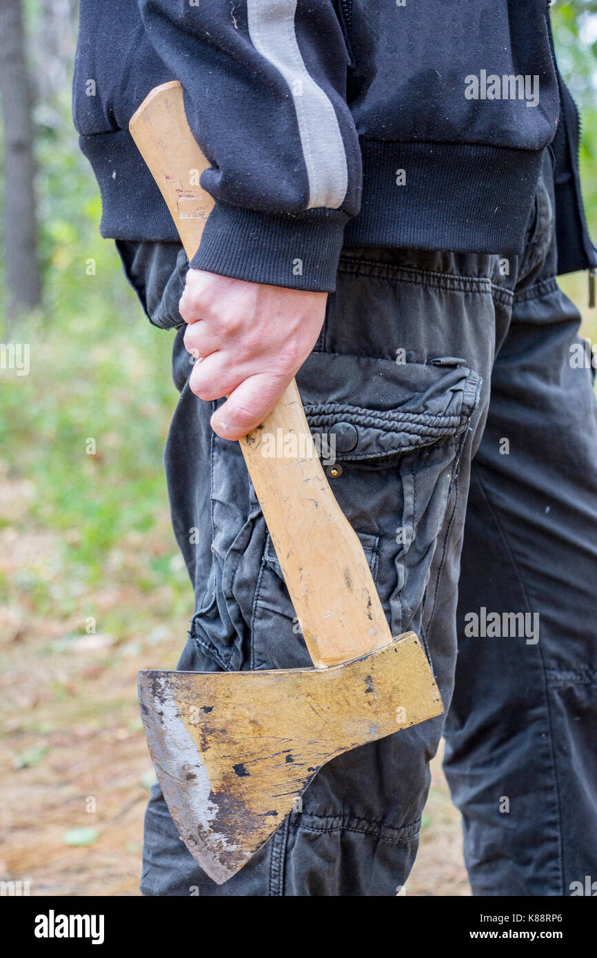 Man holds an axe Stock Photo - Alamy