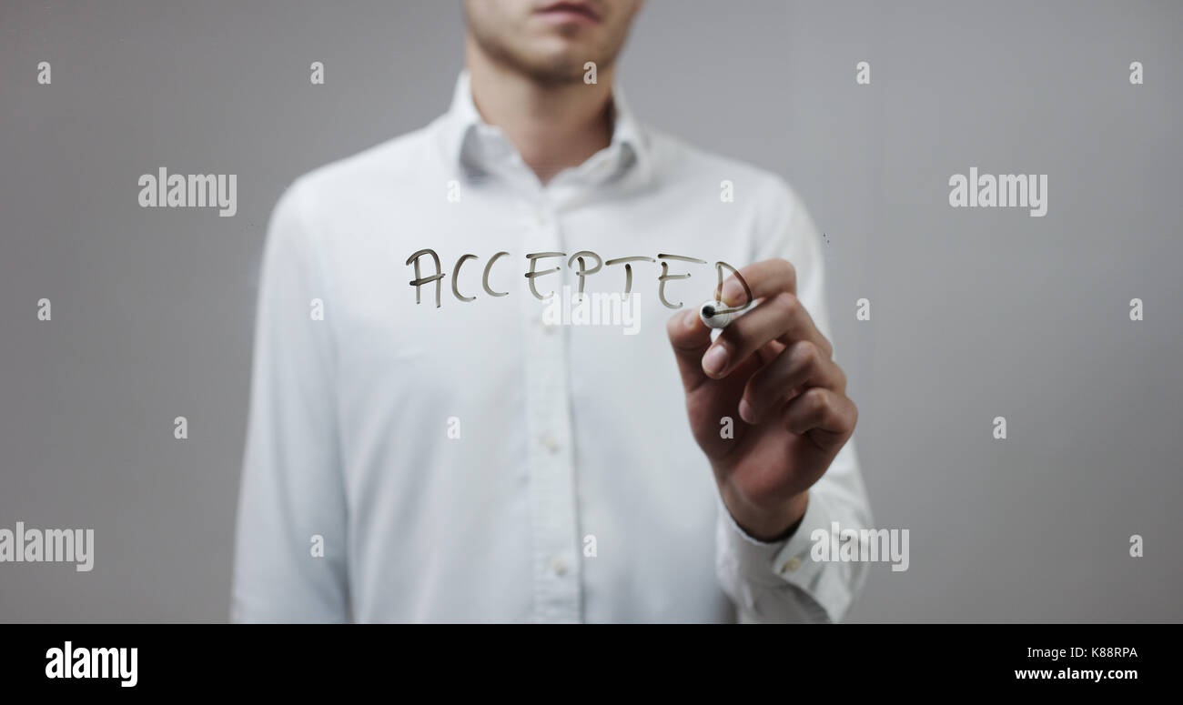Accepted , Man Writing on Glass Stock Photo - Alamy