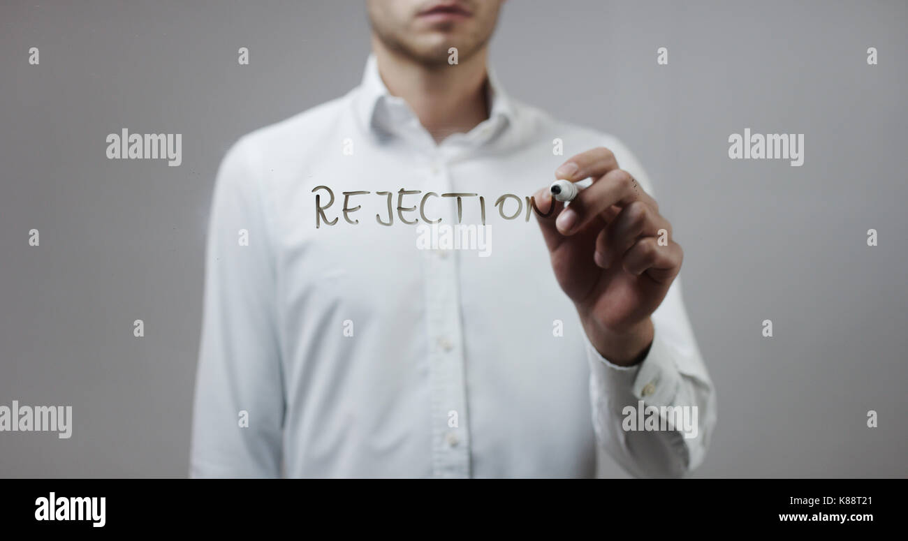 Rejection , Man Writing on Glass Stock Photo - Alamy