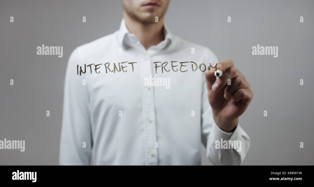 Internet freedom , Man Writing on Glass Stock Photo - Alamy