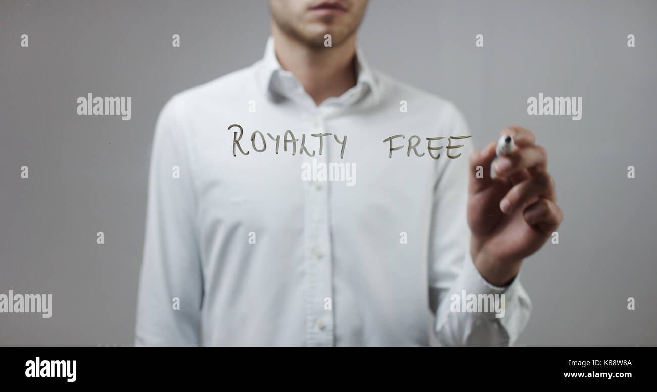 Royalty free , Man Writing on Glass Stock Photo - Alamy