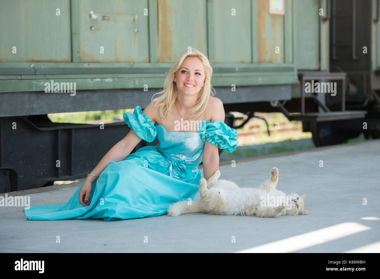 Portrait of beautiful young woman with cute cat Stock Photo - Alamy