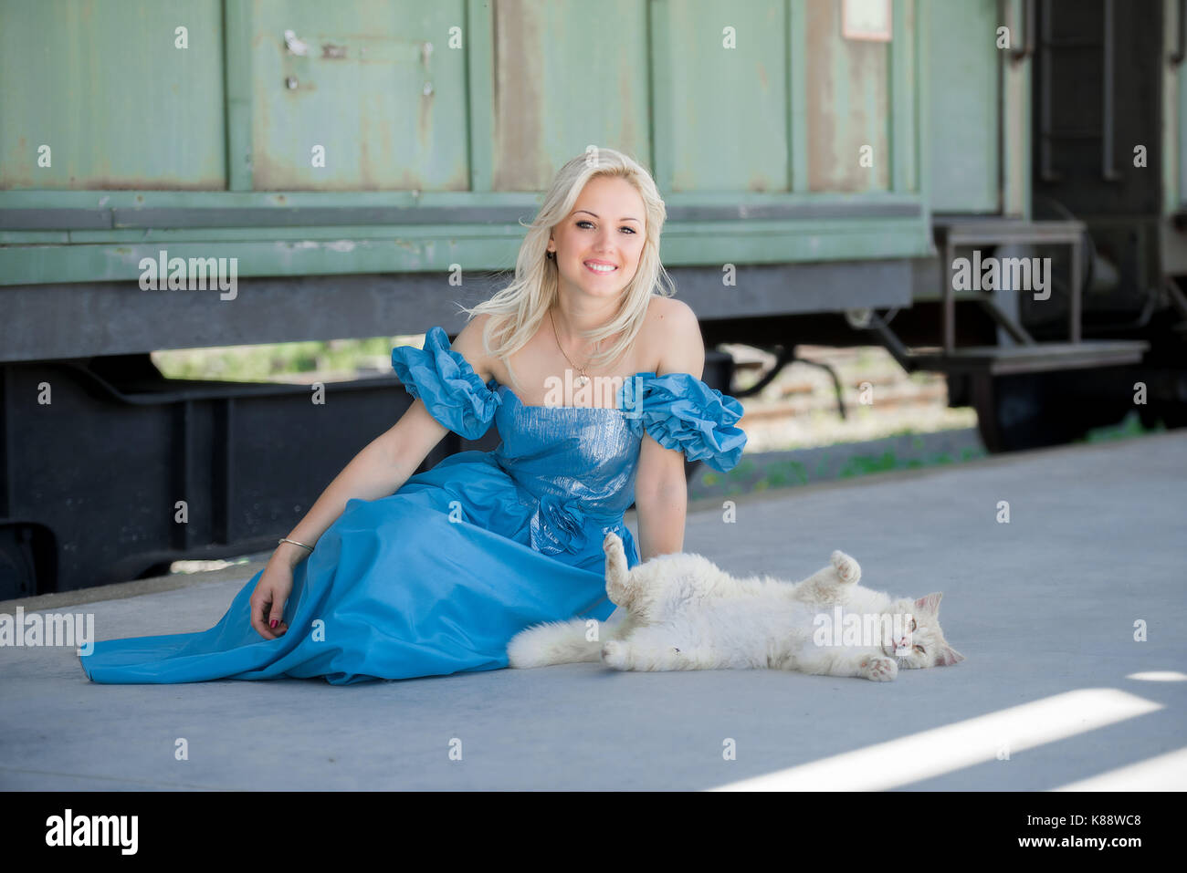 Portrait of beautiful young woman with cute cat Stock Photo - Alamy