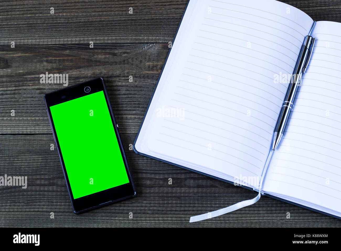 smart phone with green screen with notepad Stock Photo - Alamy