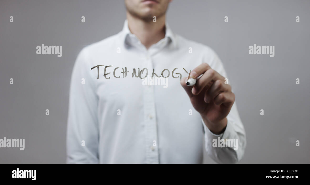 Technology , Man Writing on Glass Stock Photo - Alamy