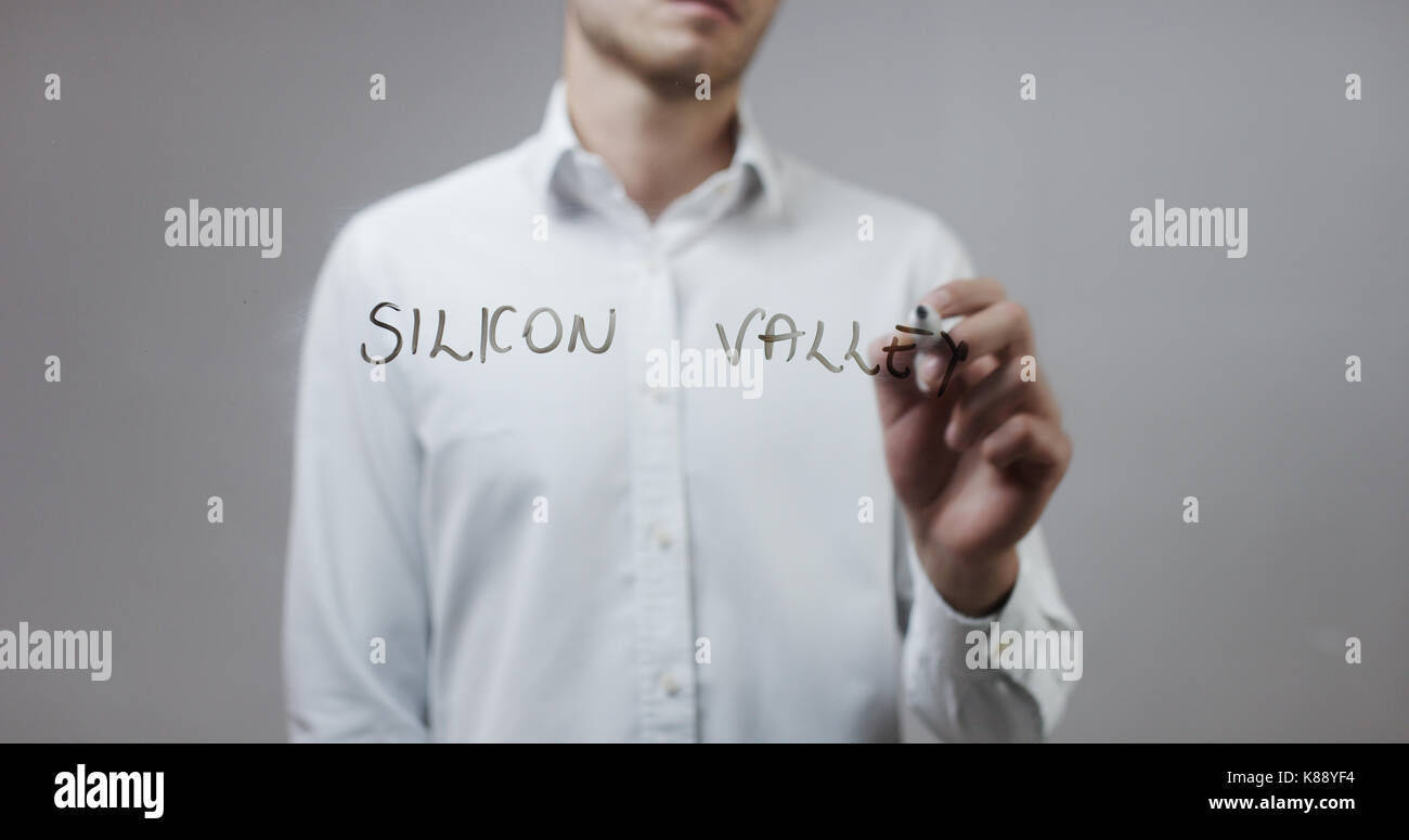 Silicon valley , Man Writing on Glass Stock Photo - Alamy