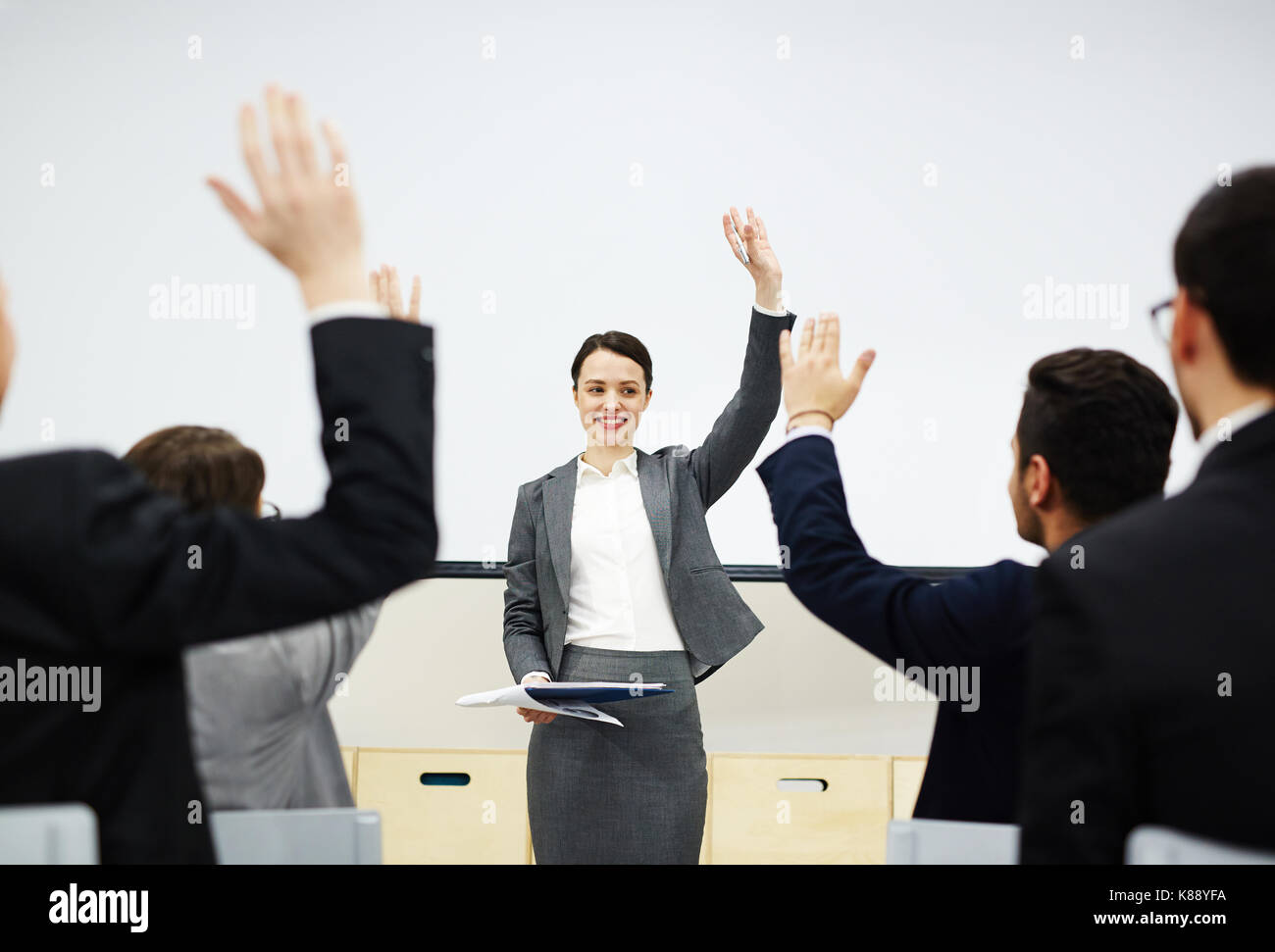 Hand raising speaker hi-res stock photography and images - Alamy