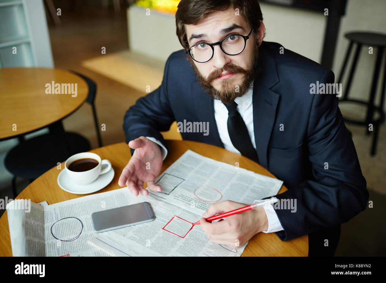 Confused man looking at camera while highlighting curious vacancy ...