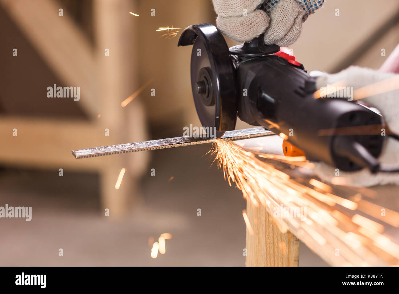 cutting metal with angle grinder, sparks from the disk Stock Photo - Alamy
