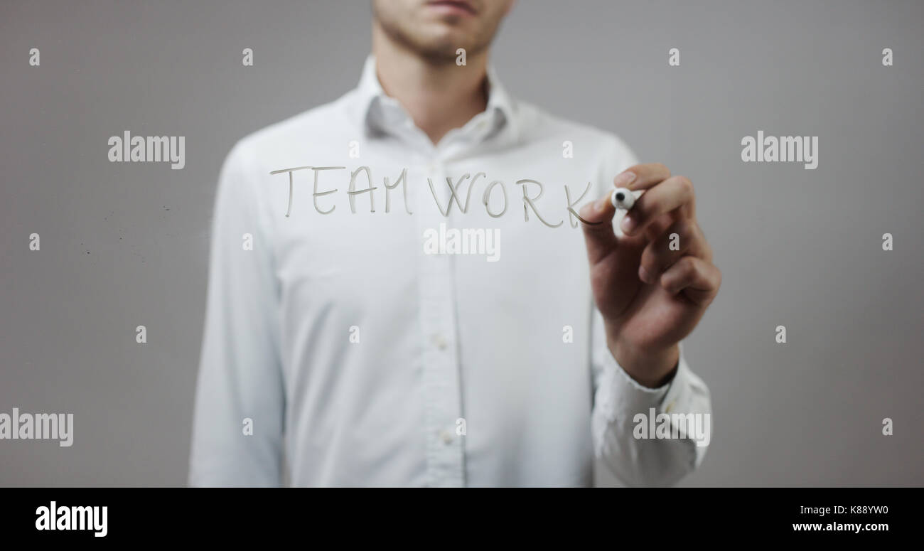 Team work, Man Writing on Glass Stock Photo - Alamy