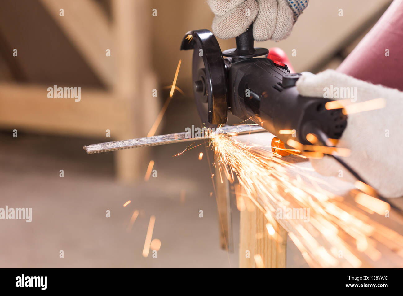 Worker Using Angle Grinder in Factory and throwing sparks Stock Photo ...