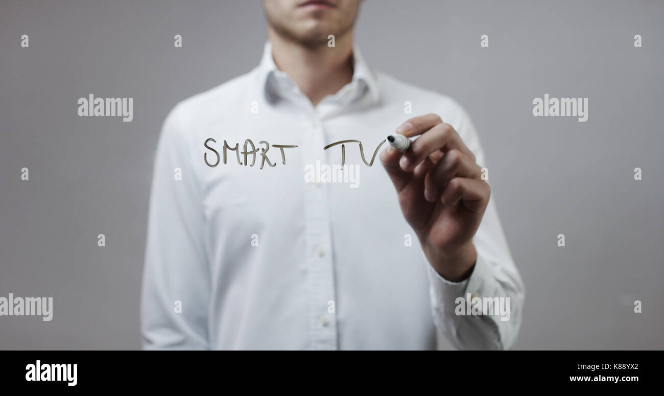 Smart TV , Man Writing on Glass Stock Photo - Alamy