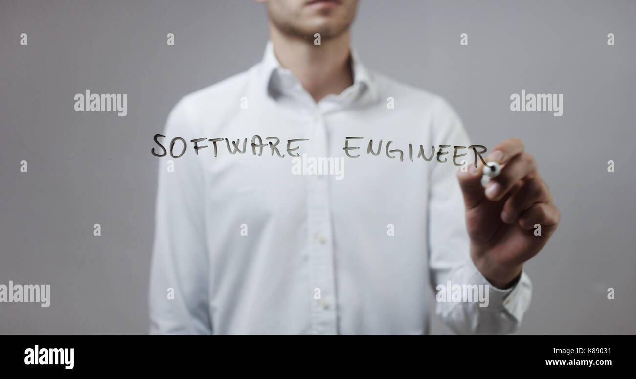 Software engineer , Man Writing on Glass Stock Photo - Alamy
