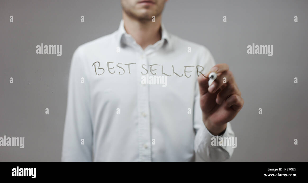Best seller, Man Writing on Glass Stock Photo - Alamy
