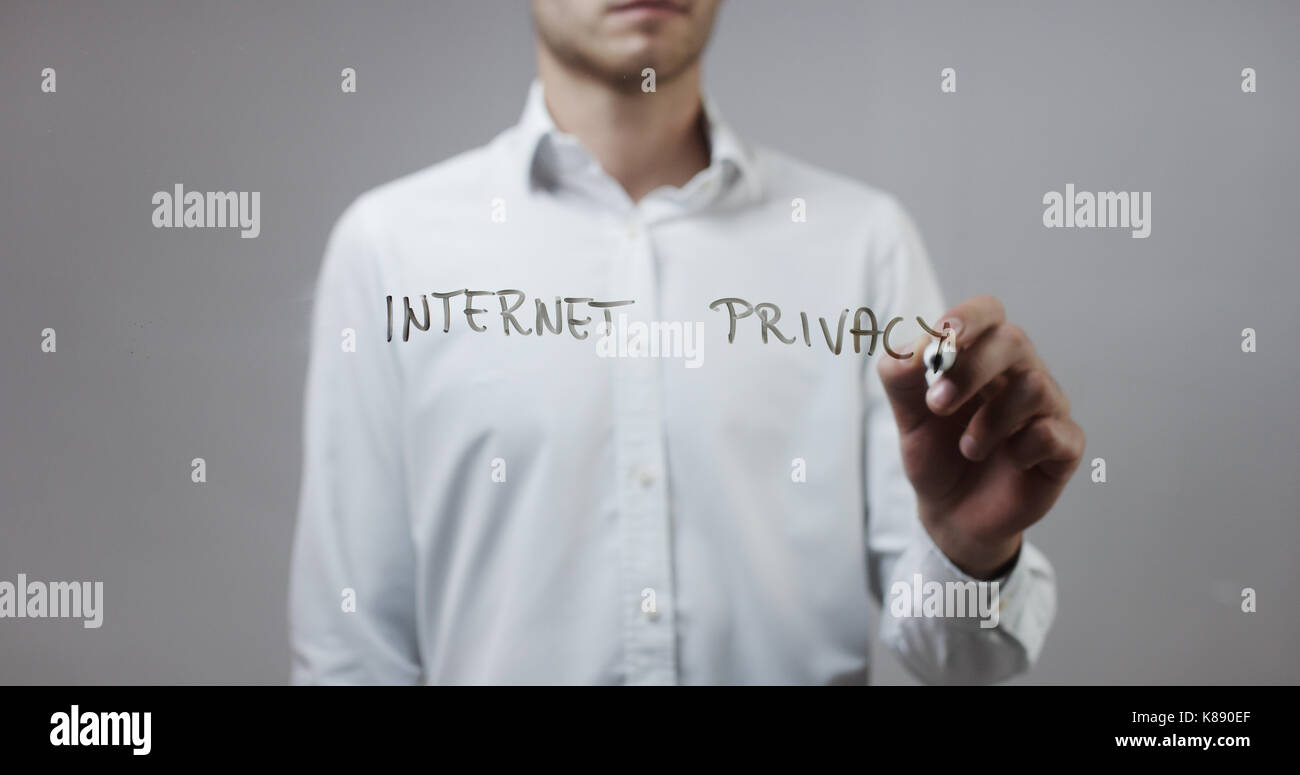 Internet privacy , Man Writing on Glass Stock Photo - Alamy