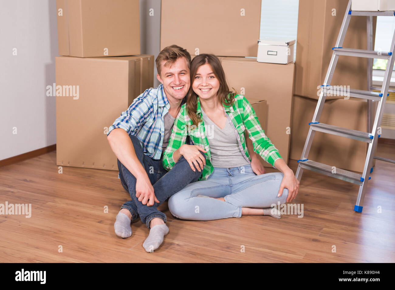 Home, people, moving and real estate concept - Portrait of happy couple ...