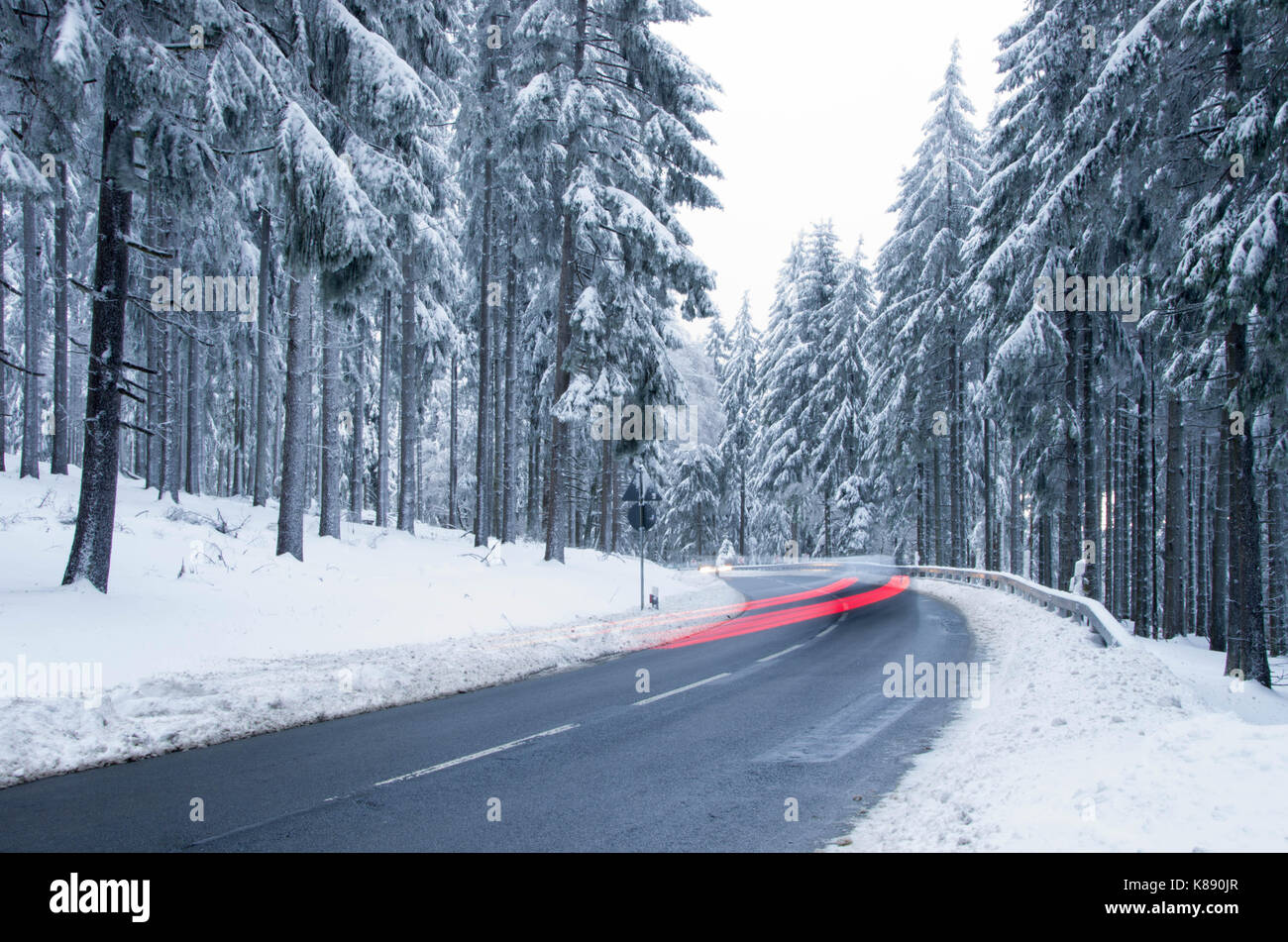 Deep snowy forest road hi-res stock photography and images - Alamy