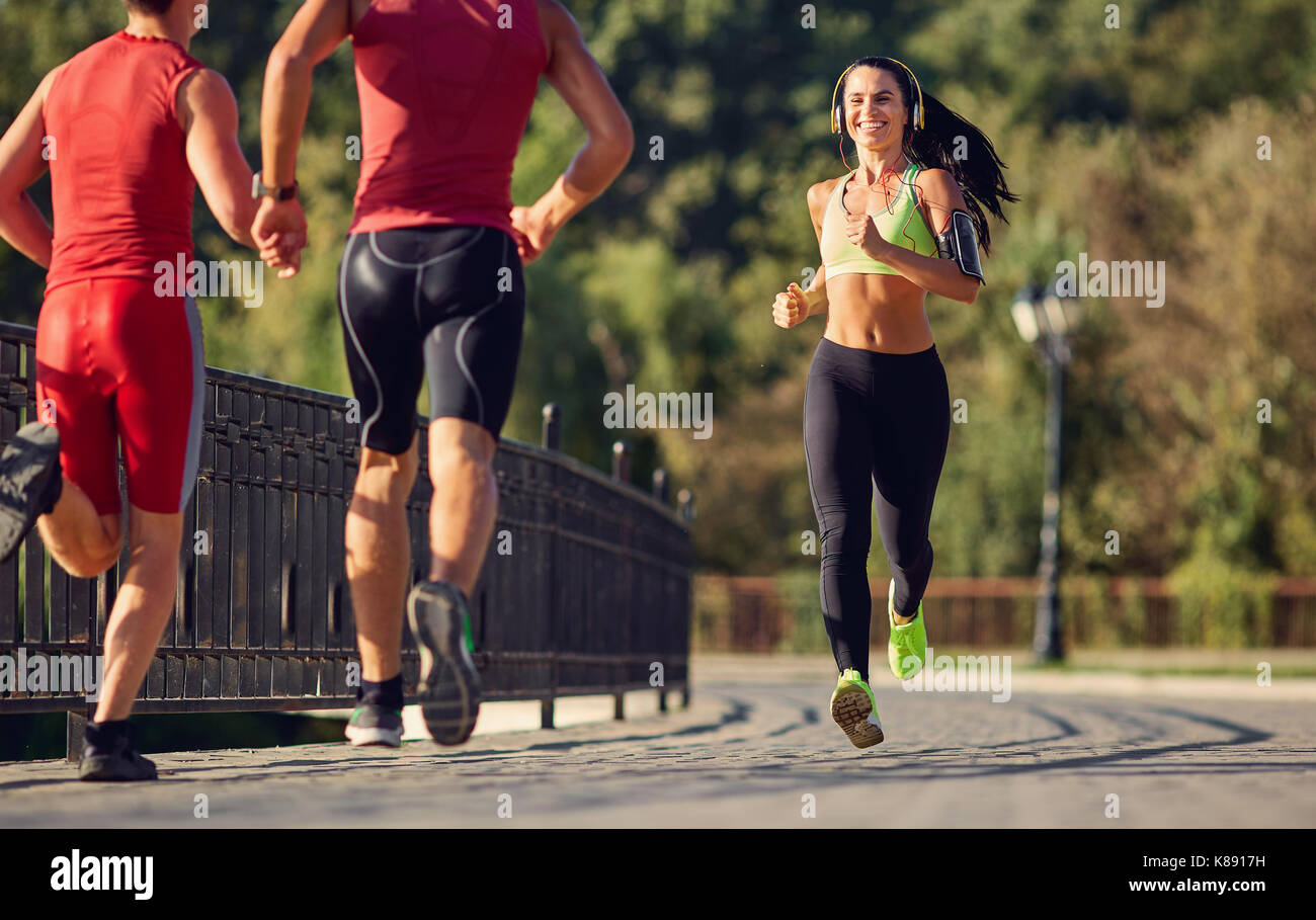 The girl runs around with a smile in the park Stock Photo - Alamy
