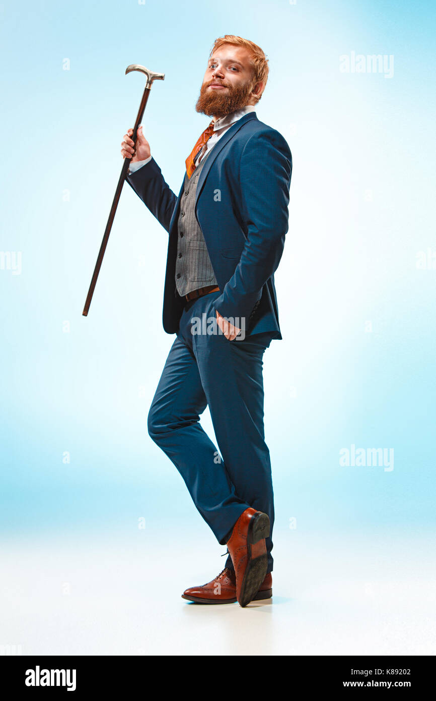 The barded man in a suit holding cane Stock Photo - Alamy