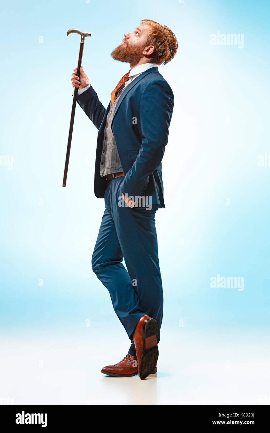 The barded man in a suit holding cane Stock Photo - Alamy
