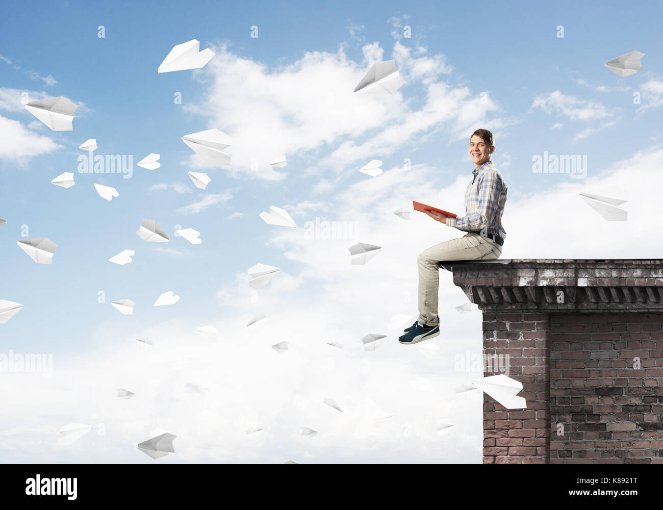 Handsome guy reading paper book hi-res stock photography and images - Alamy