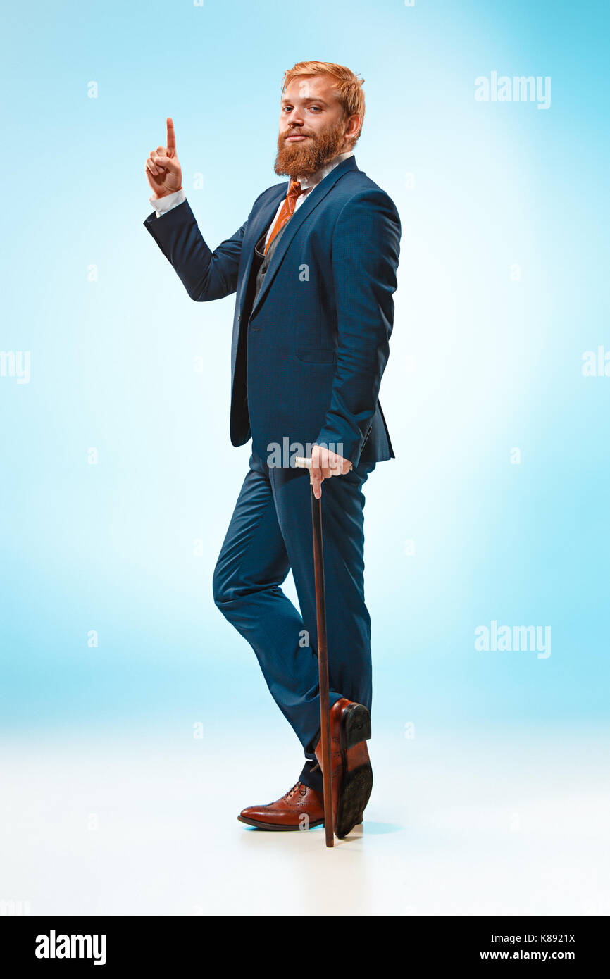 The barded man in a suit holding cane Stock Photo - Alamy