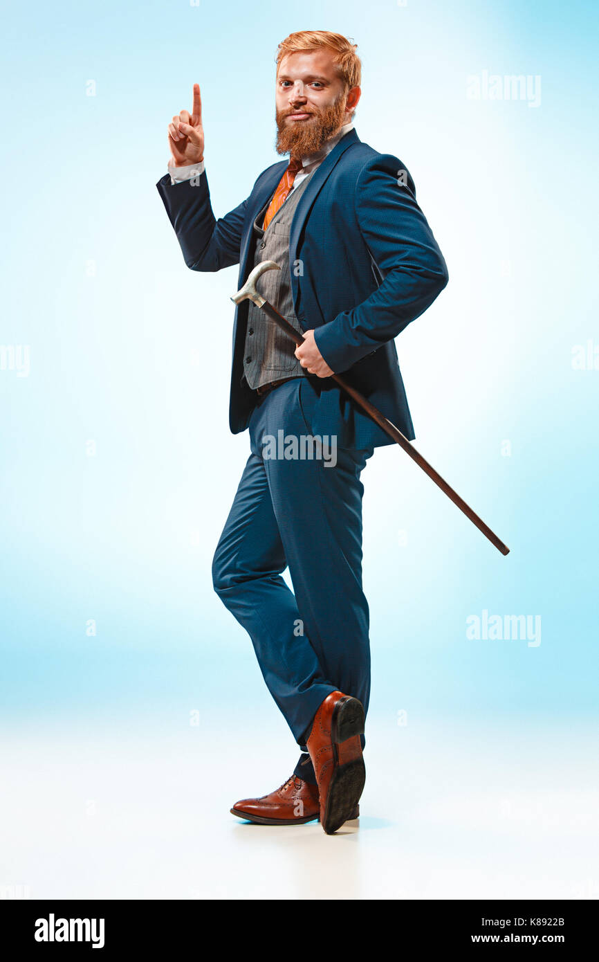 The barded man in a suit holding cane Stock Photo - Alamy